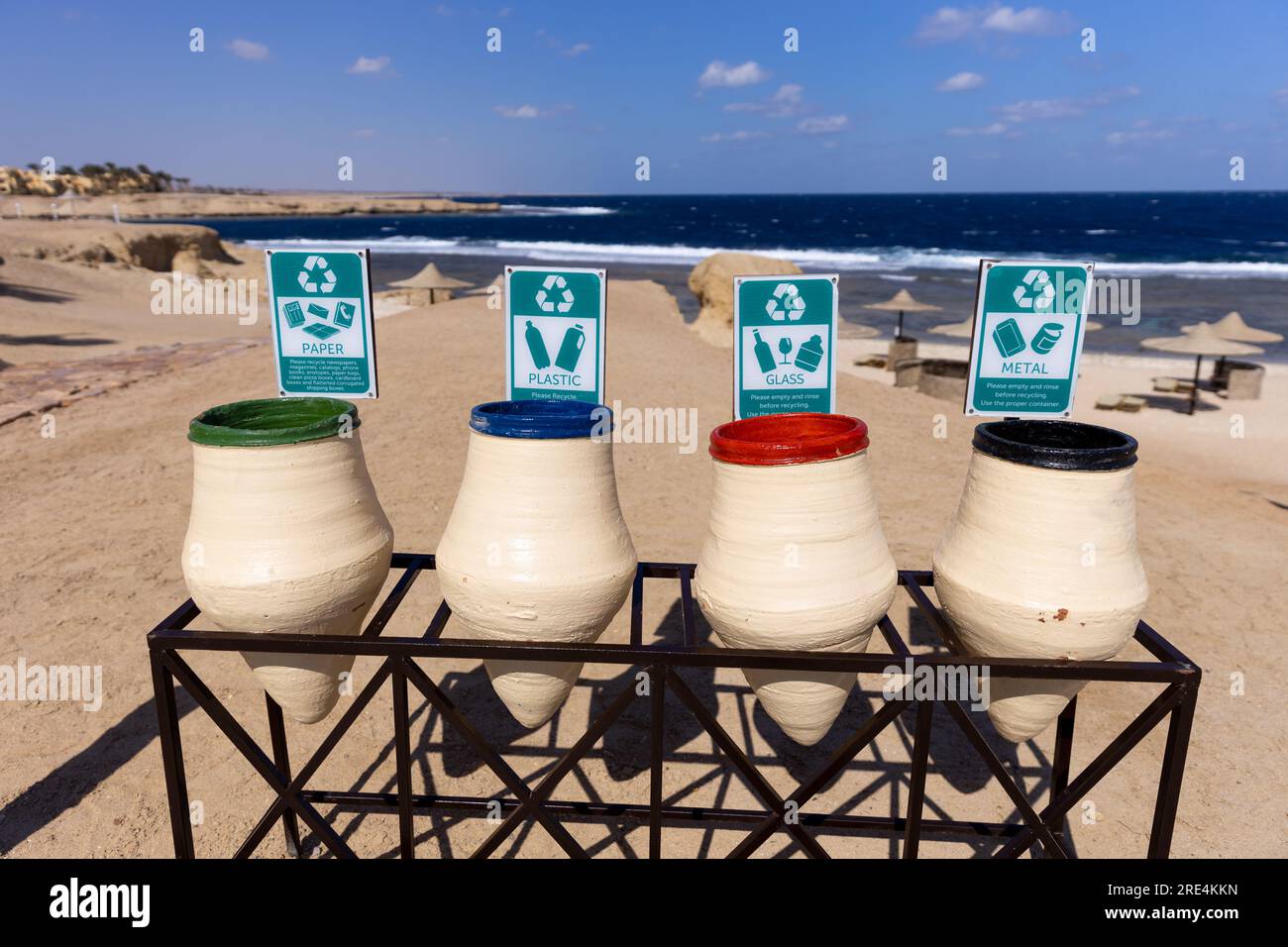 Four containers for garbage sorting and recycling. Green, blue, red and ...