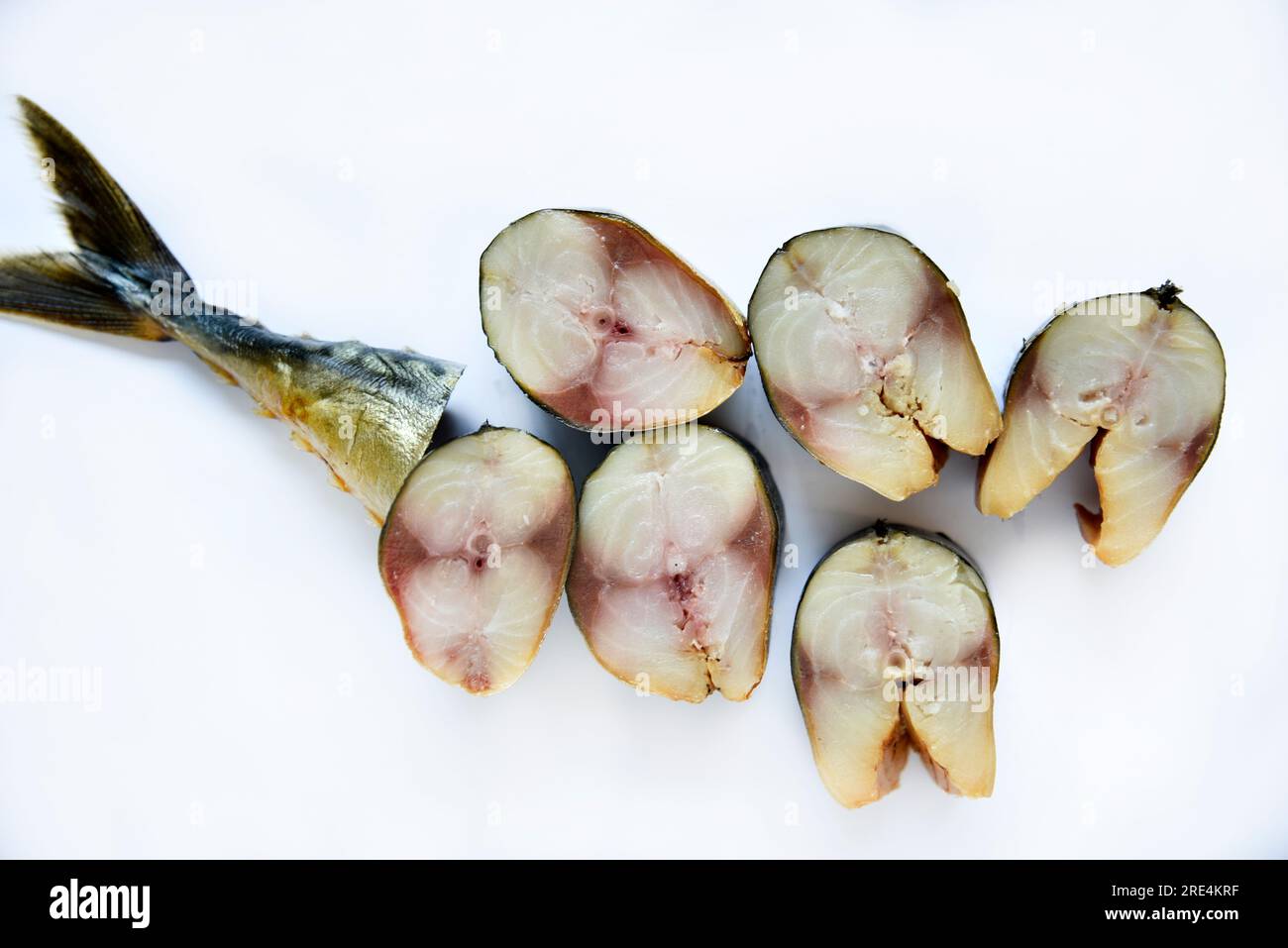 Cold smoked mackerel cut into slices on a white background. Top view ...