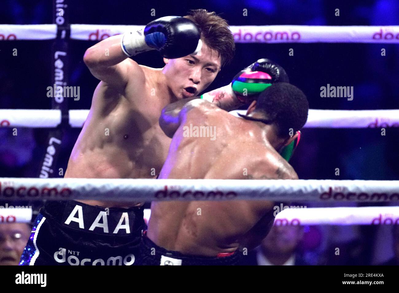 Naoya Inoue, left, of Japan throws a punch against Stephen Fulton of ...