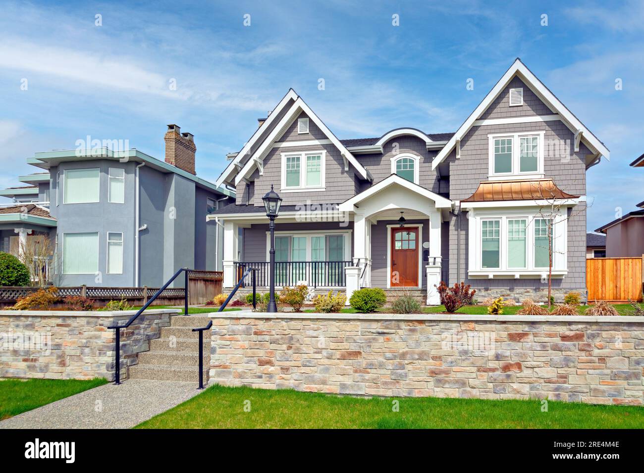Luxury residential houses with landscaped front yard on the terrace ...