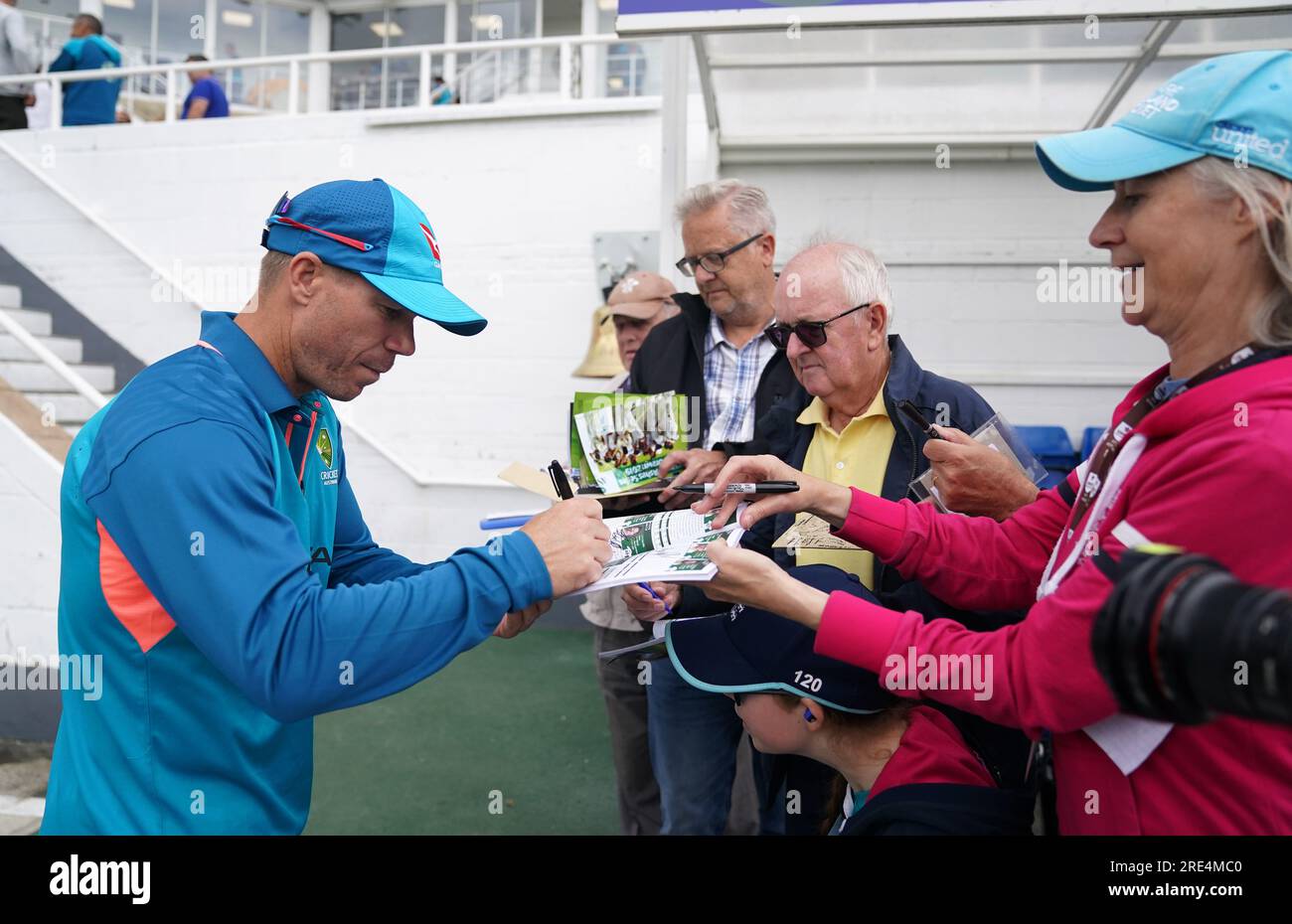 Australia's David Warner signs autographs before a nets session ahead ...