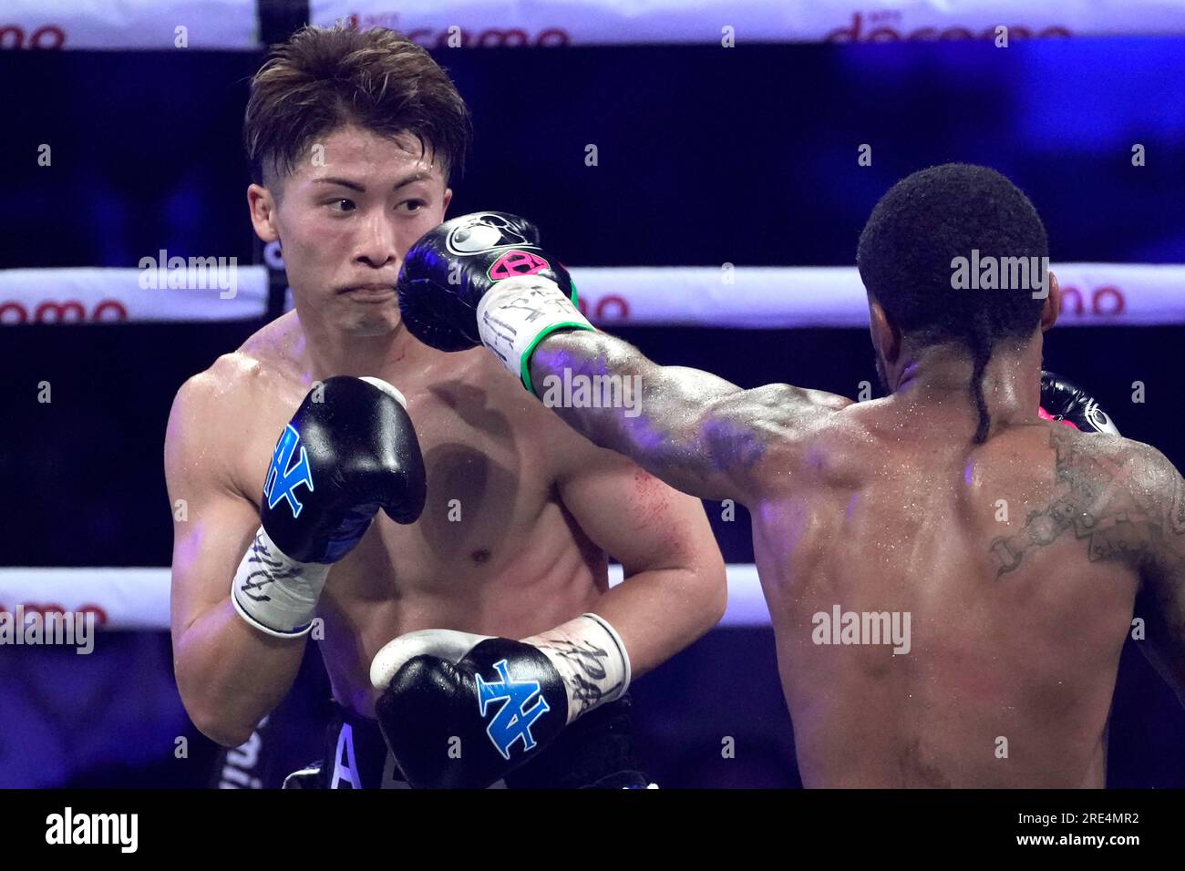 Stephen Fulton, right, of the U.S. throws a punch against Naoya Inoue ...