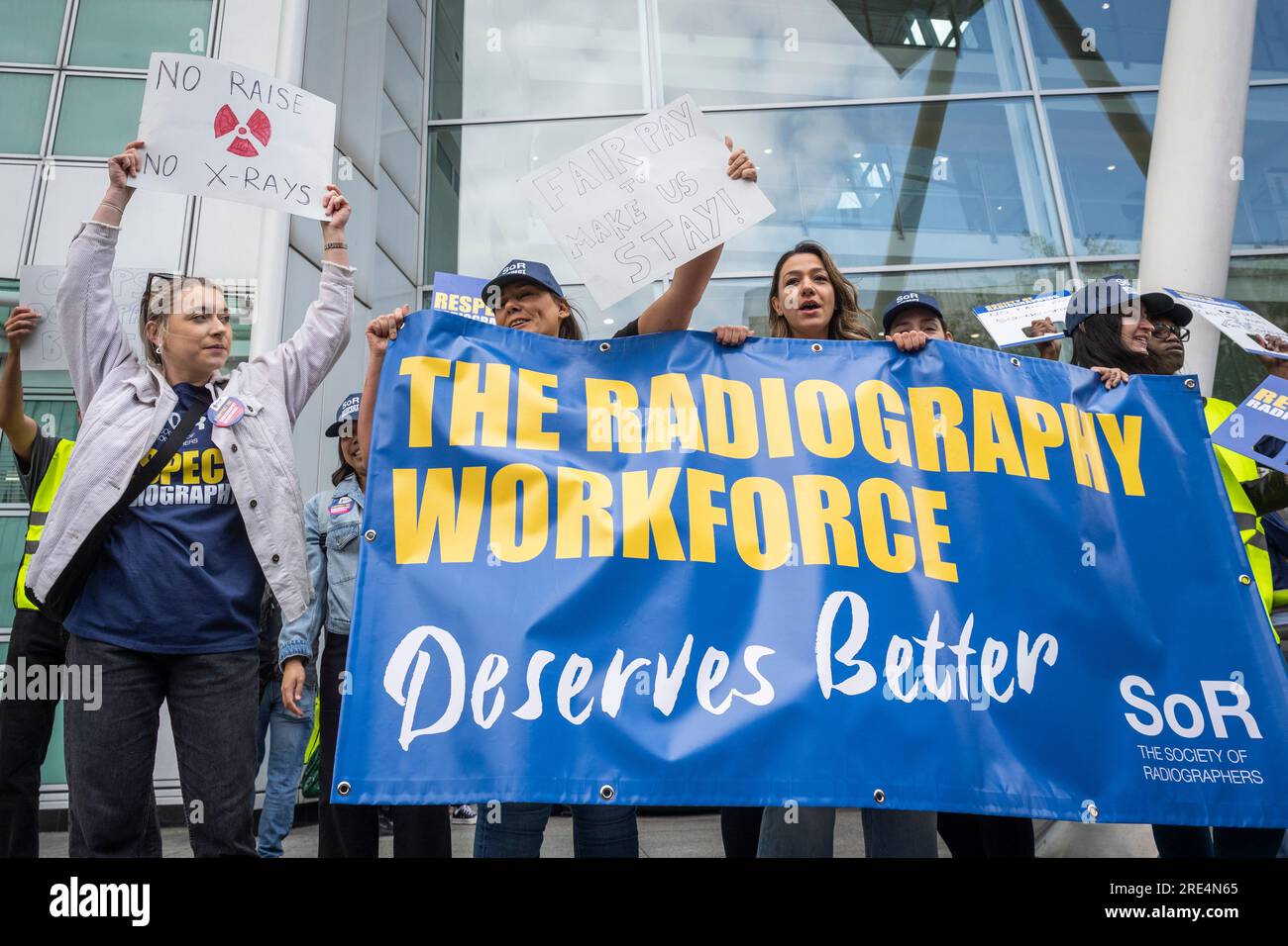 London, UK. 25 July 2023. Radiographers at a picket line outside ...