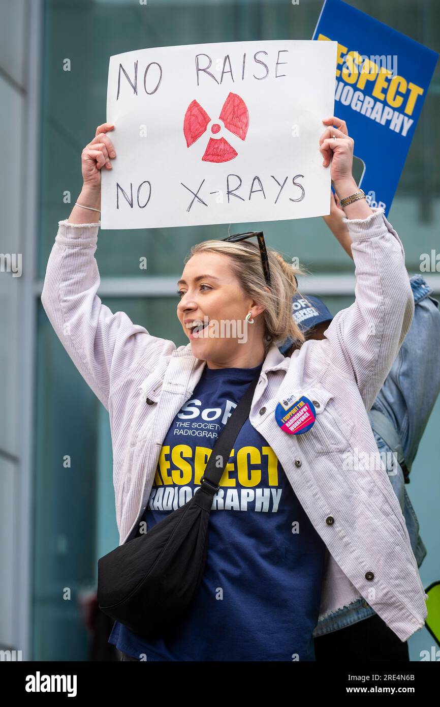 London, UK. 25 July 2023. A radiographer at a picket line outside ...