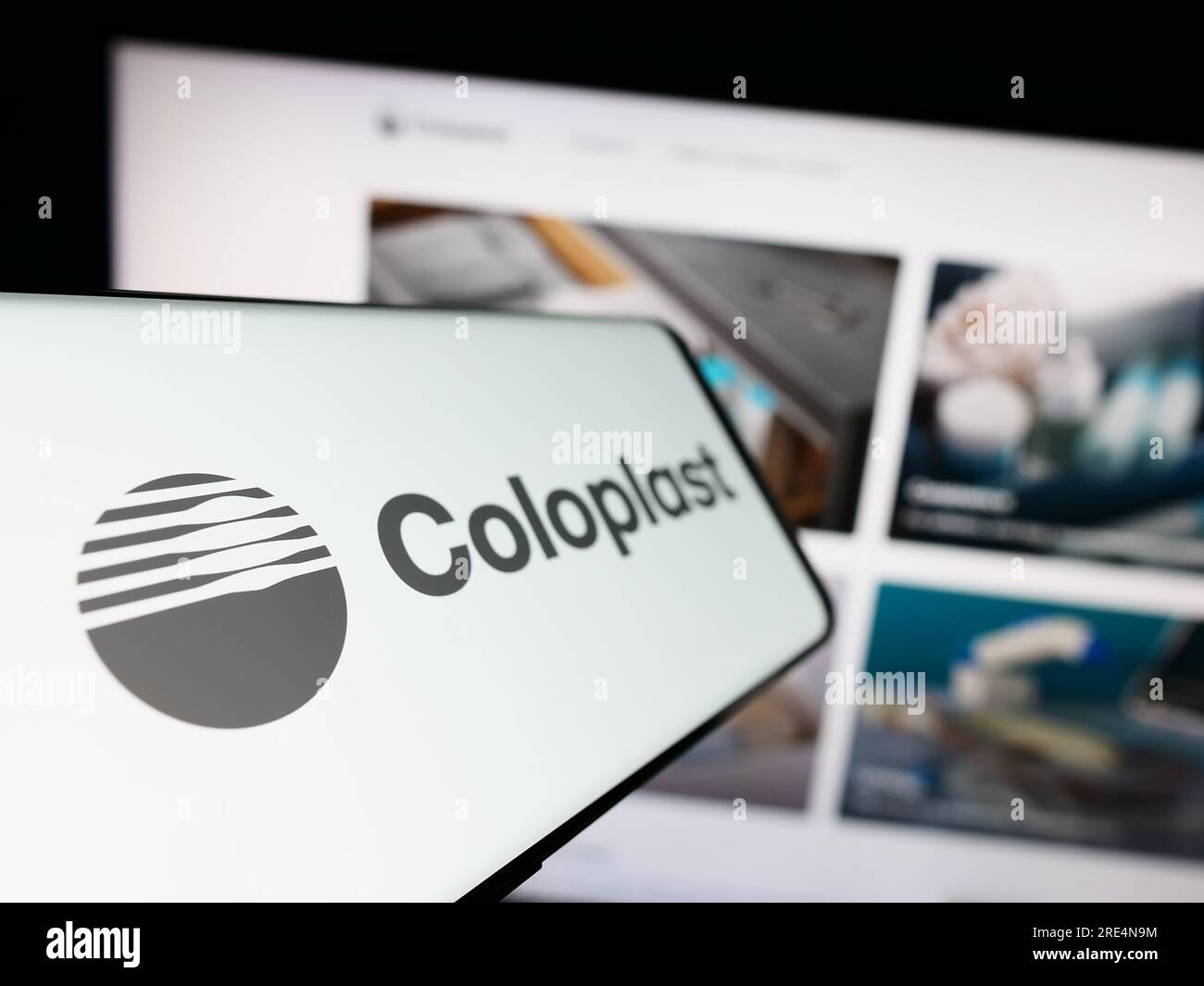 Mobile phone with logo of Danish healthcare company Coloplast AS on ...