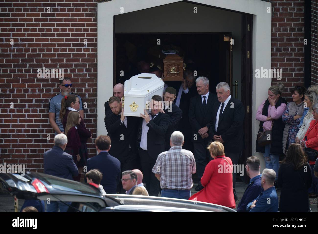 The coffins of Eoin Fitzpatrick and his son Dylan Fitzpatrick, are ...