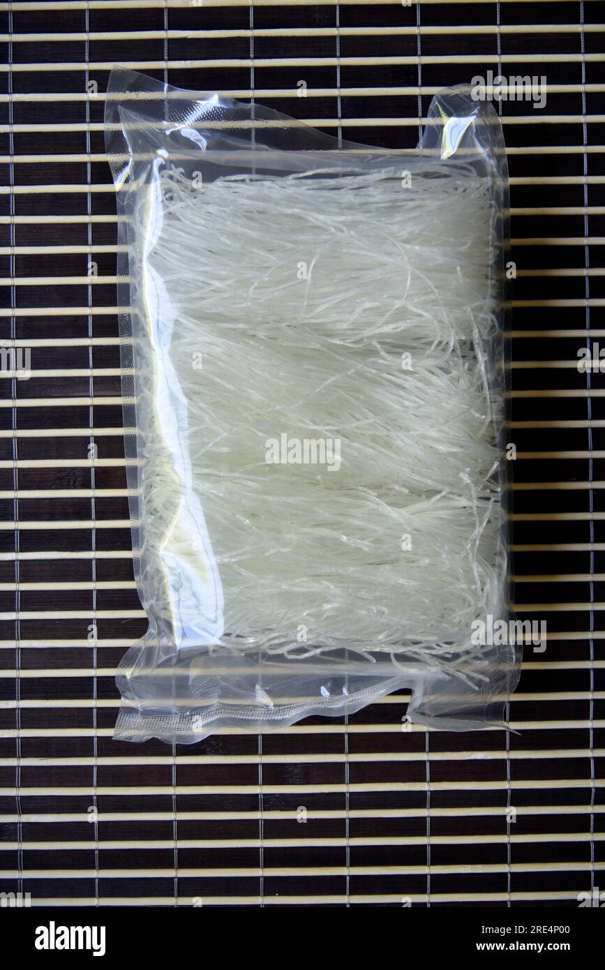 Dry rice noodles for cooking Korean dishes. Asian food. Top view ...