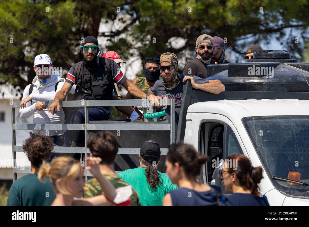 Greece. 25th July, 2023. Volunteers on a pickup truck drive to a new ...