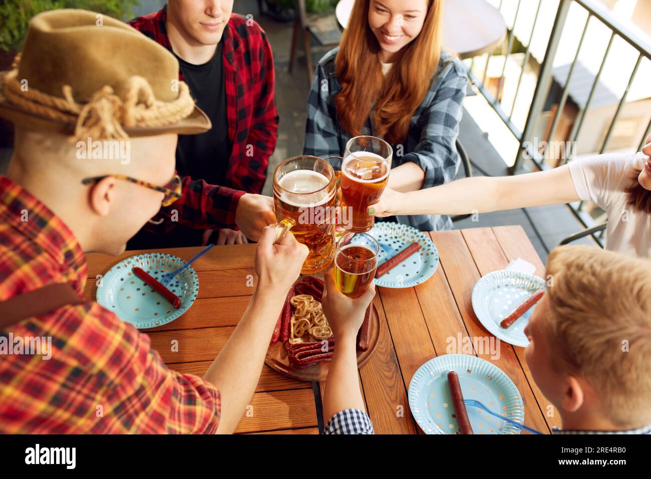 Tio view image of young people, friends cheerfully spending time ...