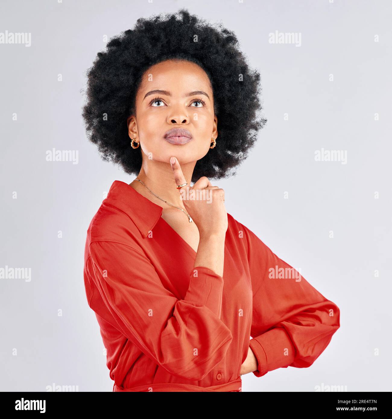 Black woman, thinking and ideas in studio, white background and vision ...