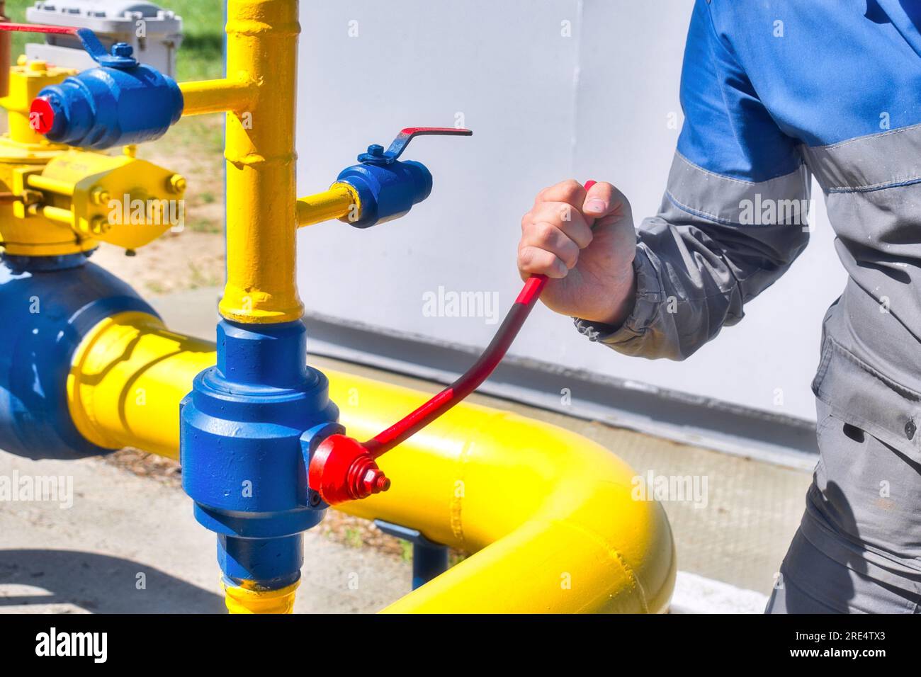 Engineer closes tap of gas pipe. Shutdown of natural gas supply. Man's ...