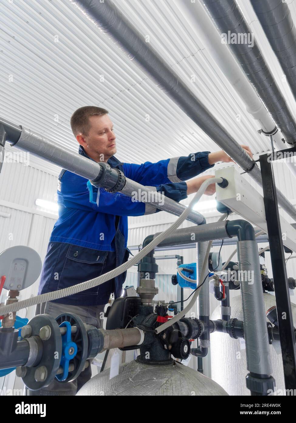 Man in boiler room working hi-res stock photography and images - Alamy
