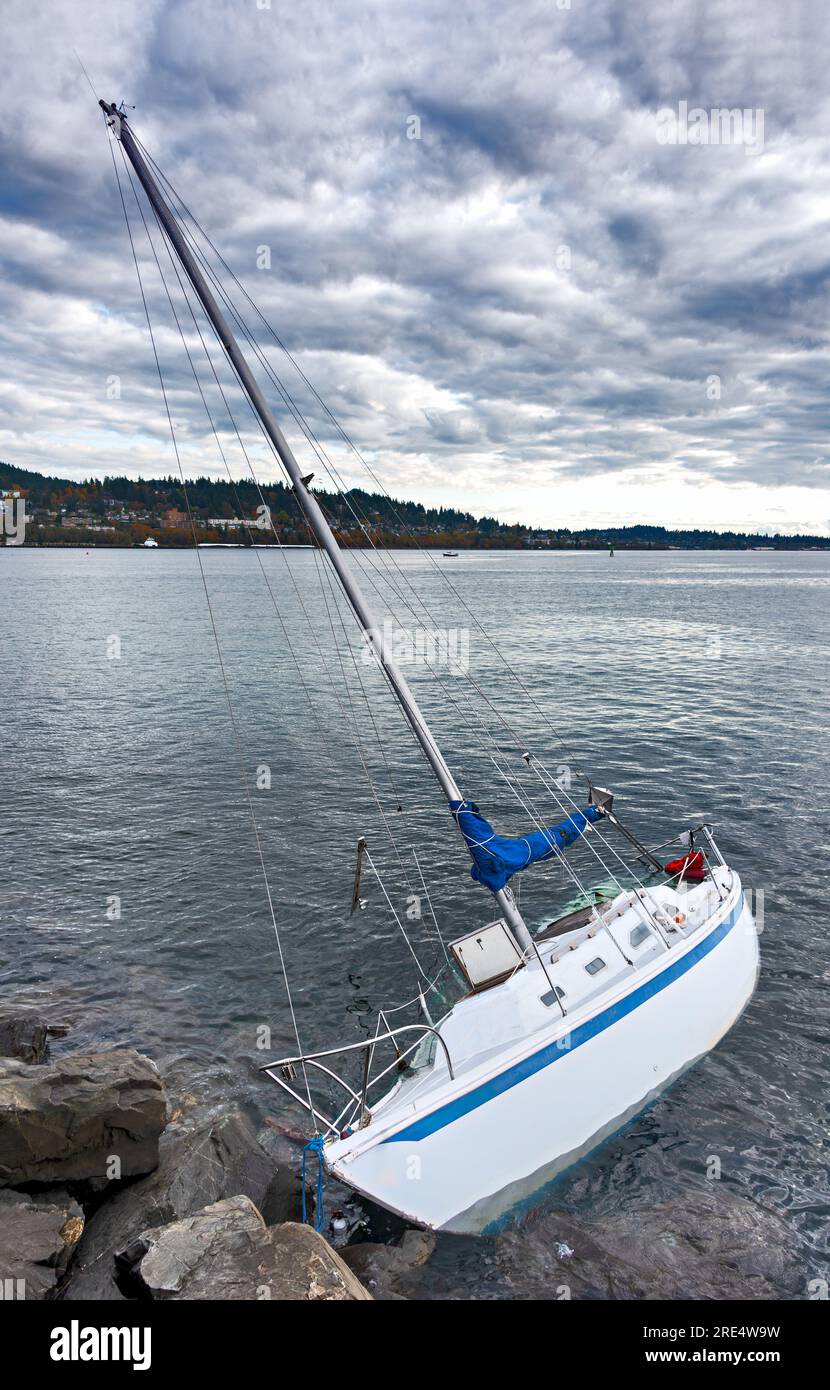 White yacht drowned in Pacific Ocean bay Stock Photo - Alamy