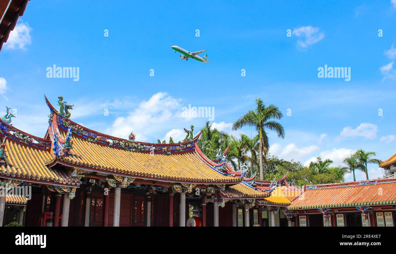 airplane in the sky over an asian temple Stock Photo - Alamy