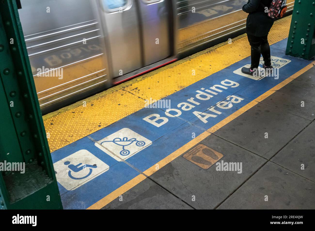 Stickers designating the Accessible Boarding Area in the West 4th Street station in the subway ...
