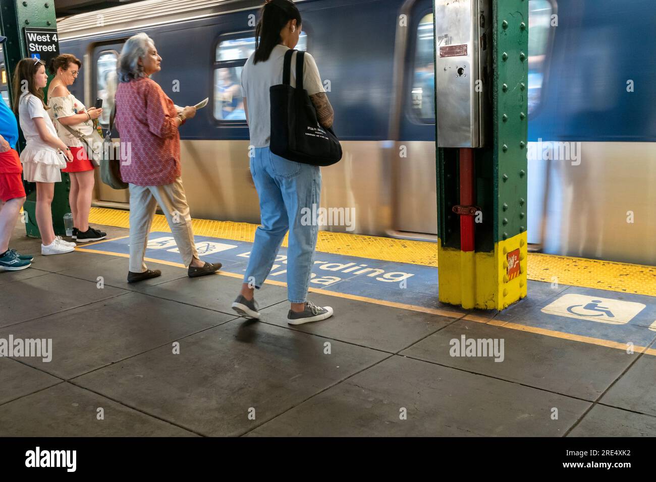 Stickers designating the Accessible Boarding Area in the West 4th Street station in the subway ...