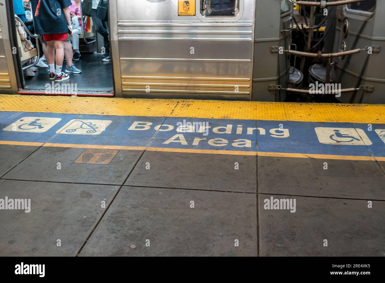 Stickers designating the Accessible Boarding Area in the West 4th Street station in the subway ...