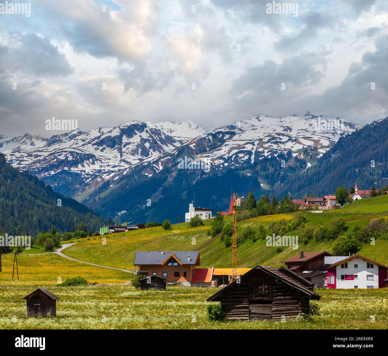 Summer Alpine mountain country view with grassy meadow and road to ...