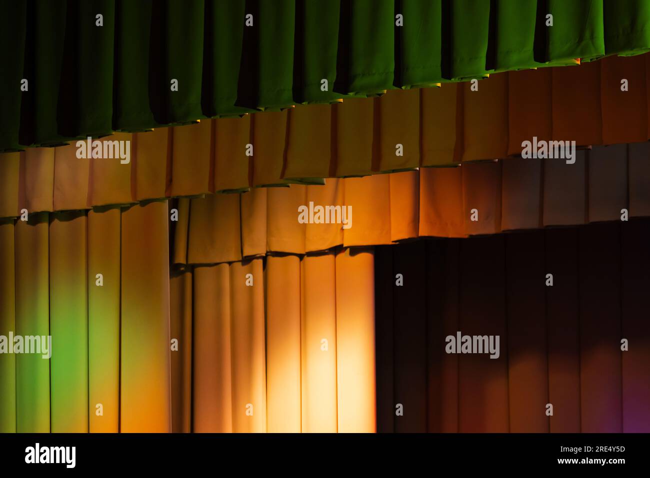 Stage curtains with colorful spot lights illumination, background photo ...
