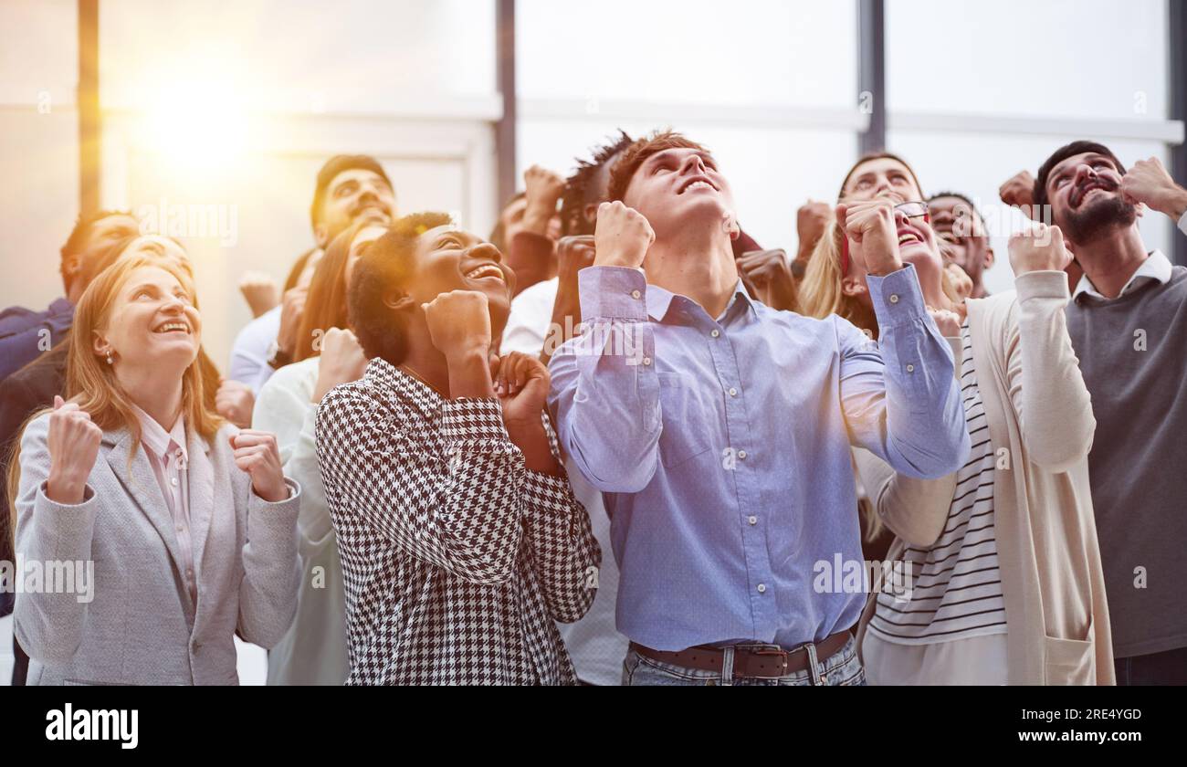 Happy people raise their hands up clenching their fists Stock Photo - Alamy