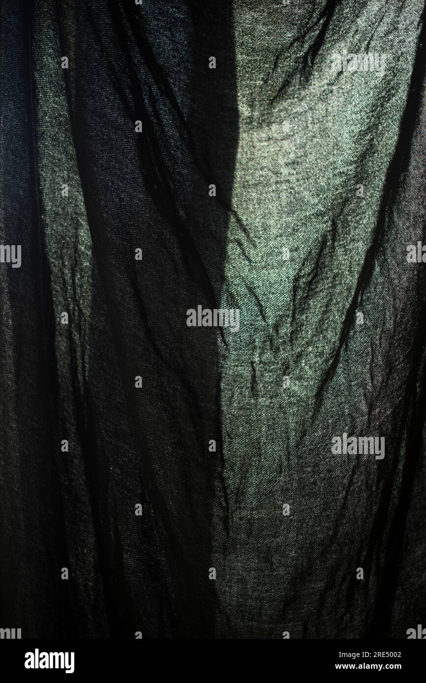 Fabric texture. Light through fabric. Curtain on window. Black cloth ...