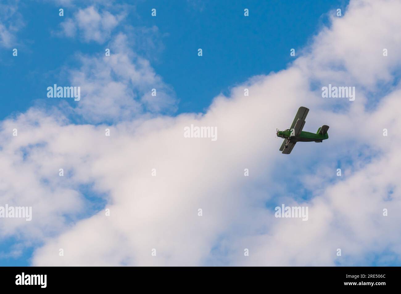 Biplane flying in blue sky at Air Show Stock Photo - Alamy