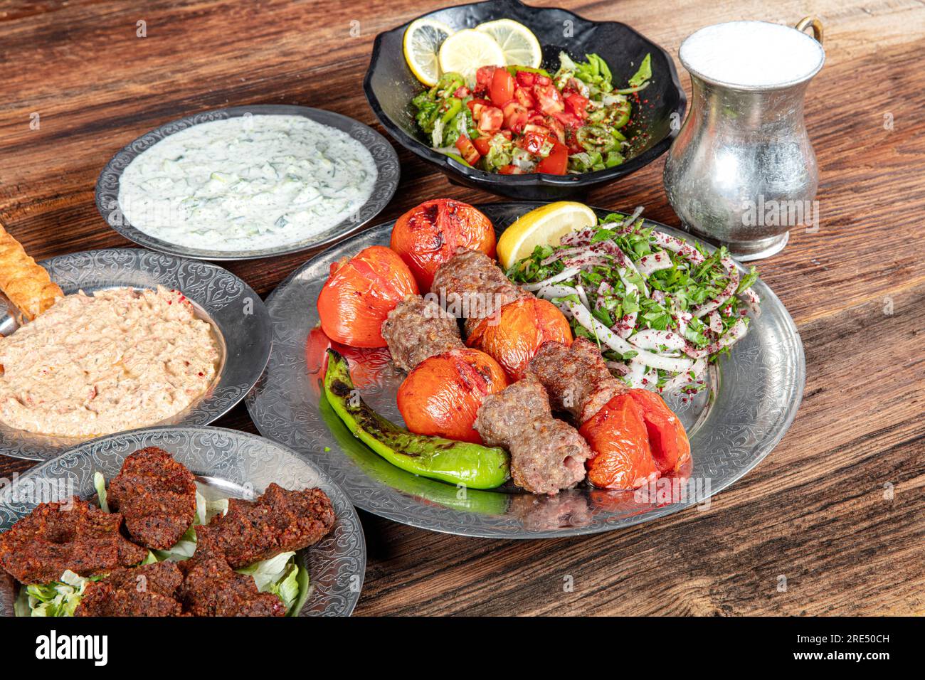 Turkish cuisine tomato kebab. Tomato kebab, domates kebab with grilled ...