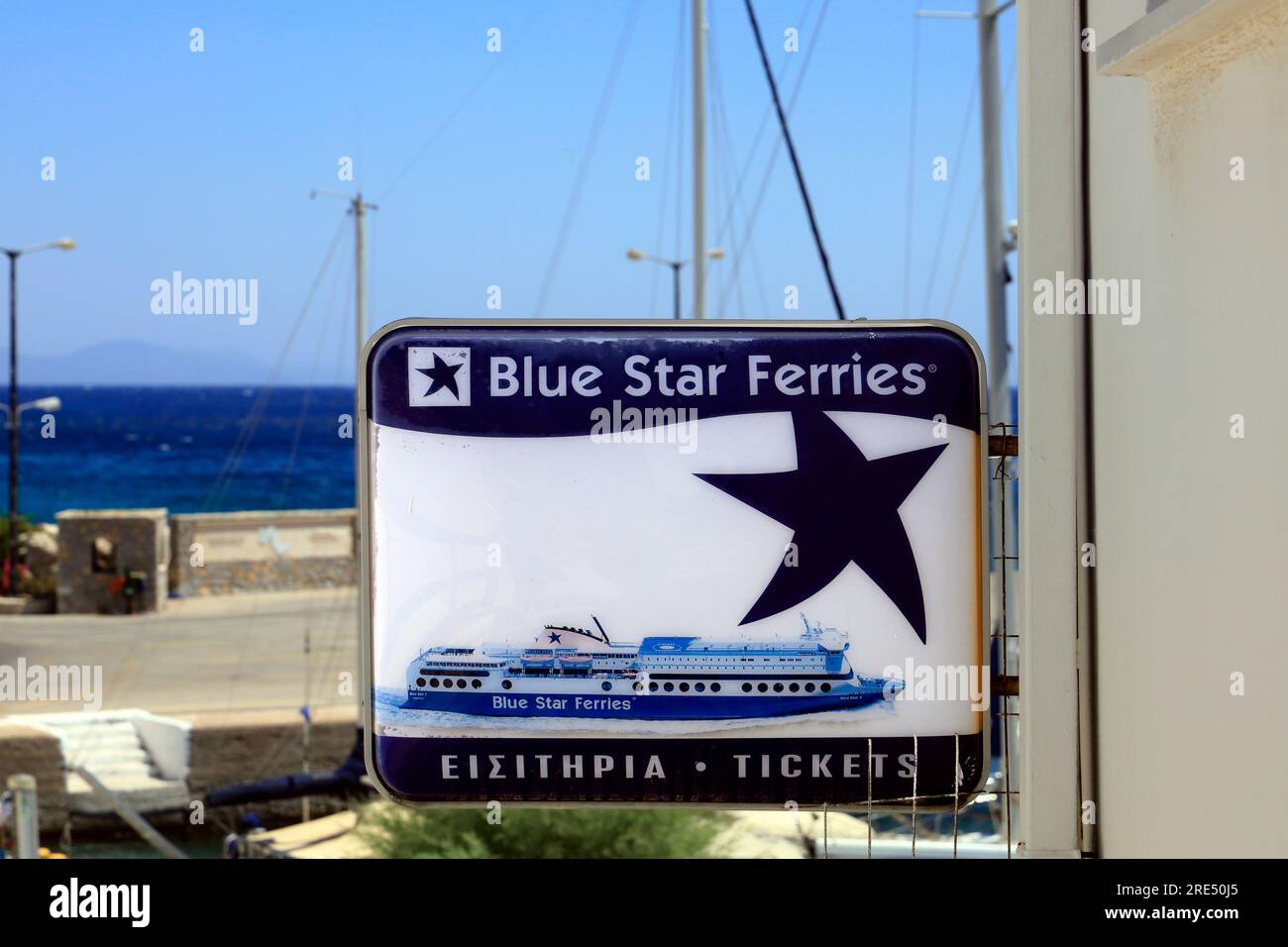 Blue Star Ferries sign at ferry ticket office, Livadia harbour, Tilos ...