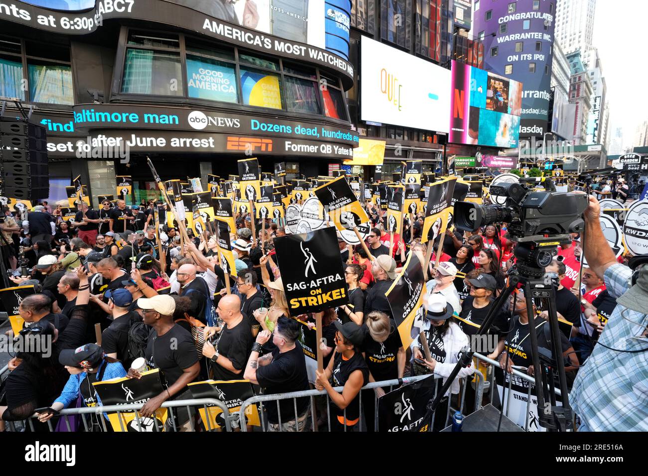 People holding picket signage attend the SAG-AFTRA "Rock the City for a ...