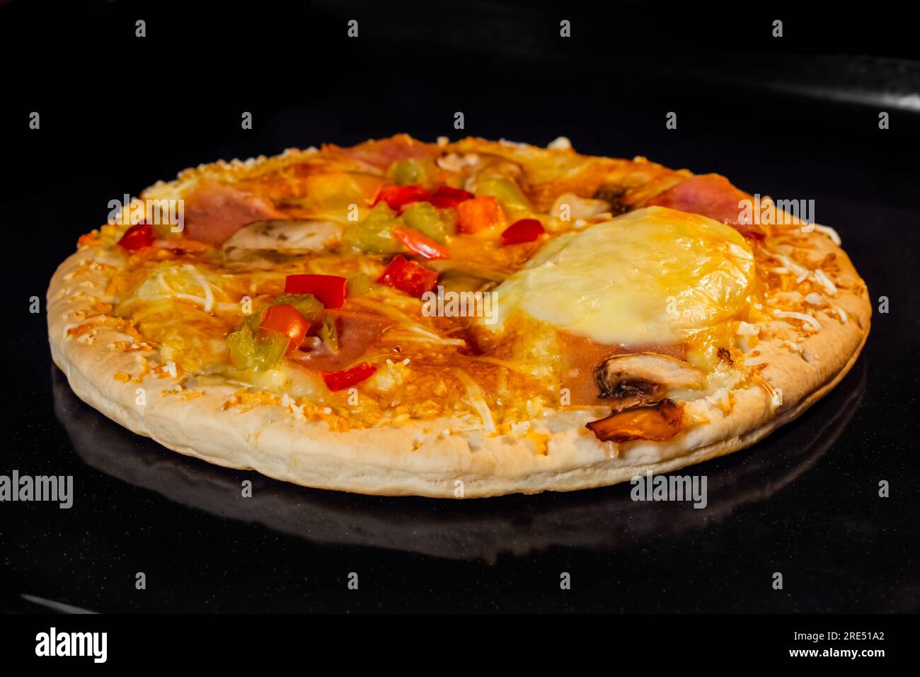 Baked homemade pizza in electric oven at home Stock Photo - Alamy