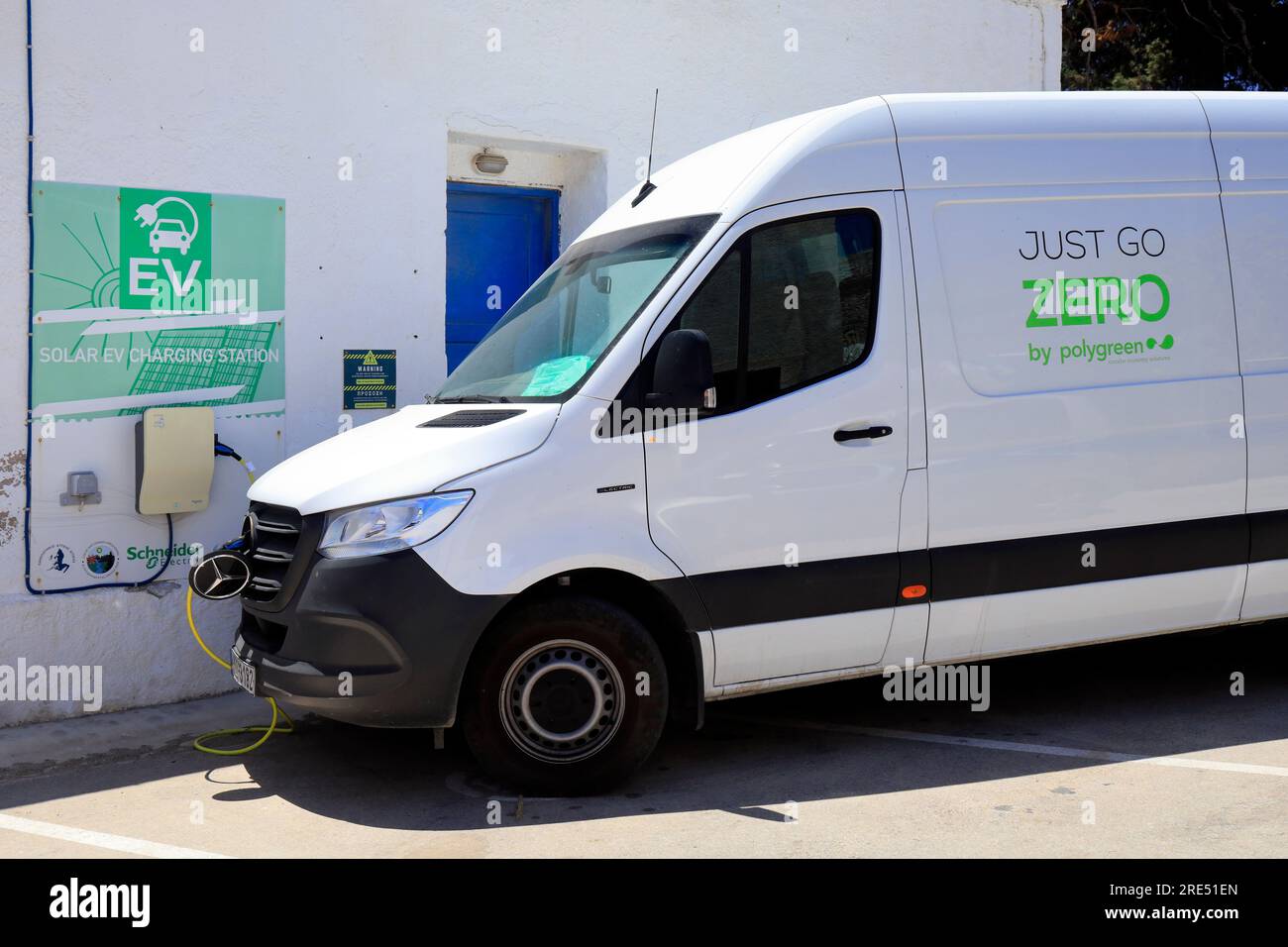 Polygreen 'Just Go Zero' van at electric vehicle charging point, Tilos ...