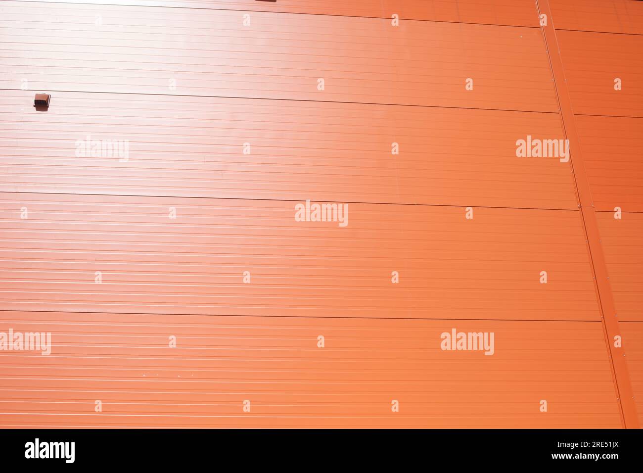 Orange wall without windows. There are no windows in building. Modern ...