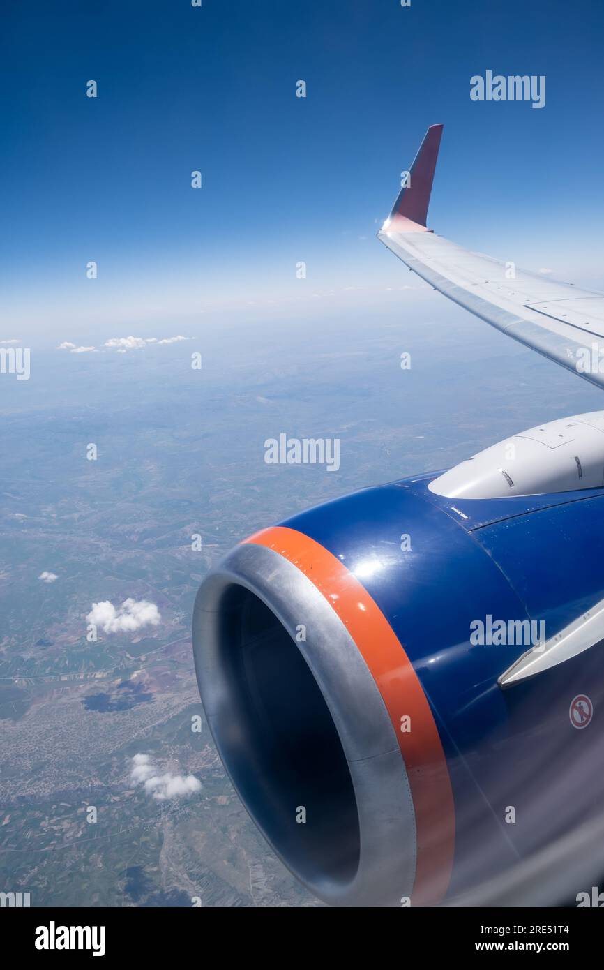 Airplane flight. Wing of an airplane flying above the clouds Stock ...