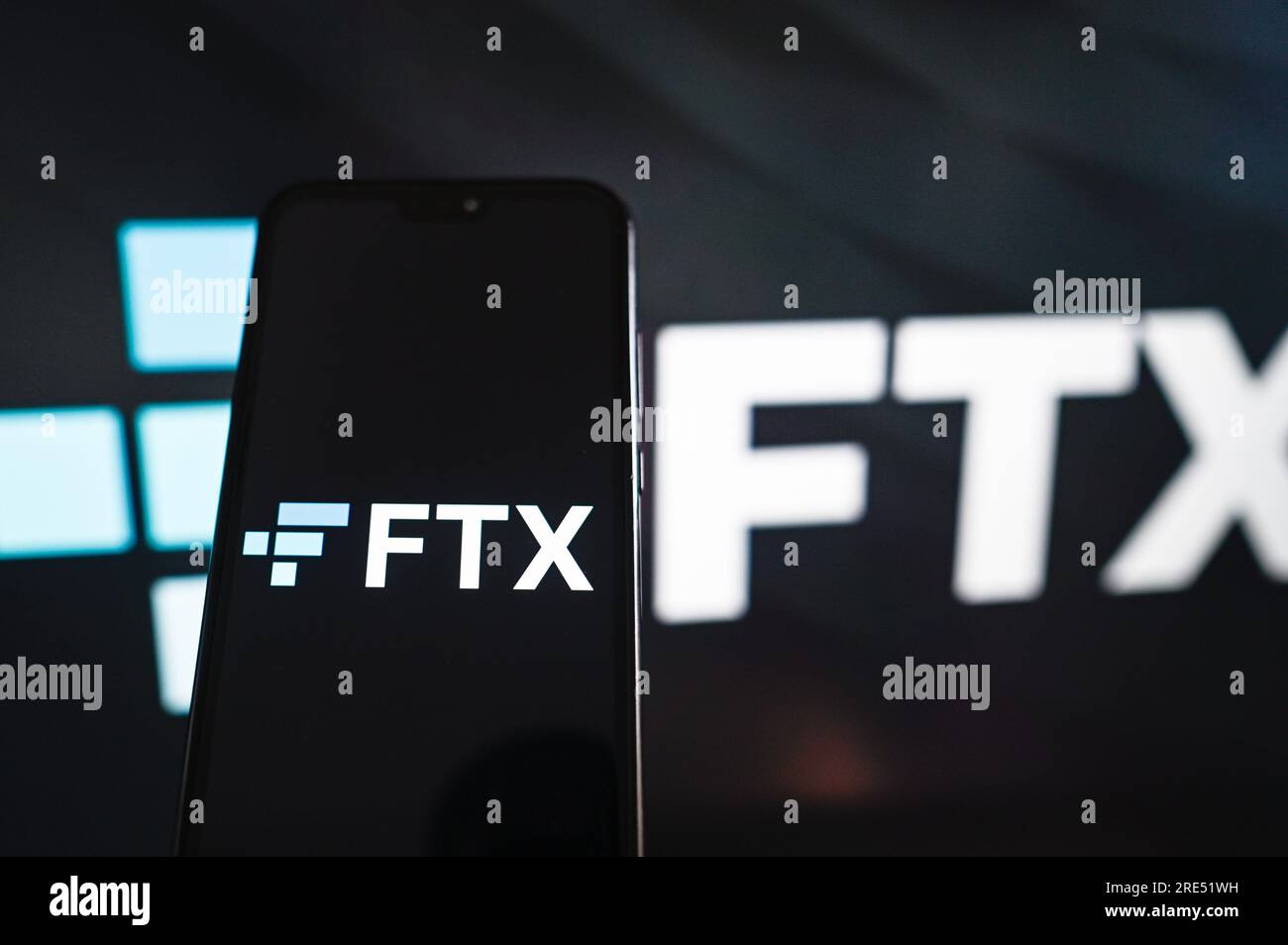 In this photo illustration a FTX logo is displayed on a smartphone and ...