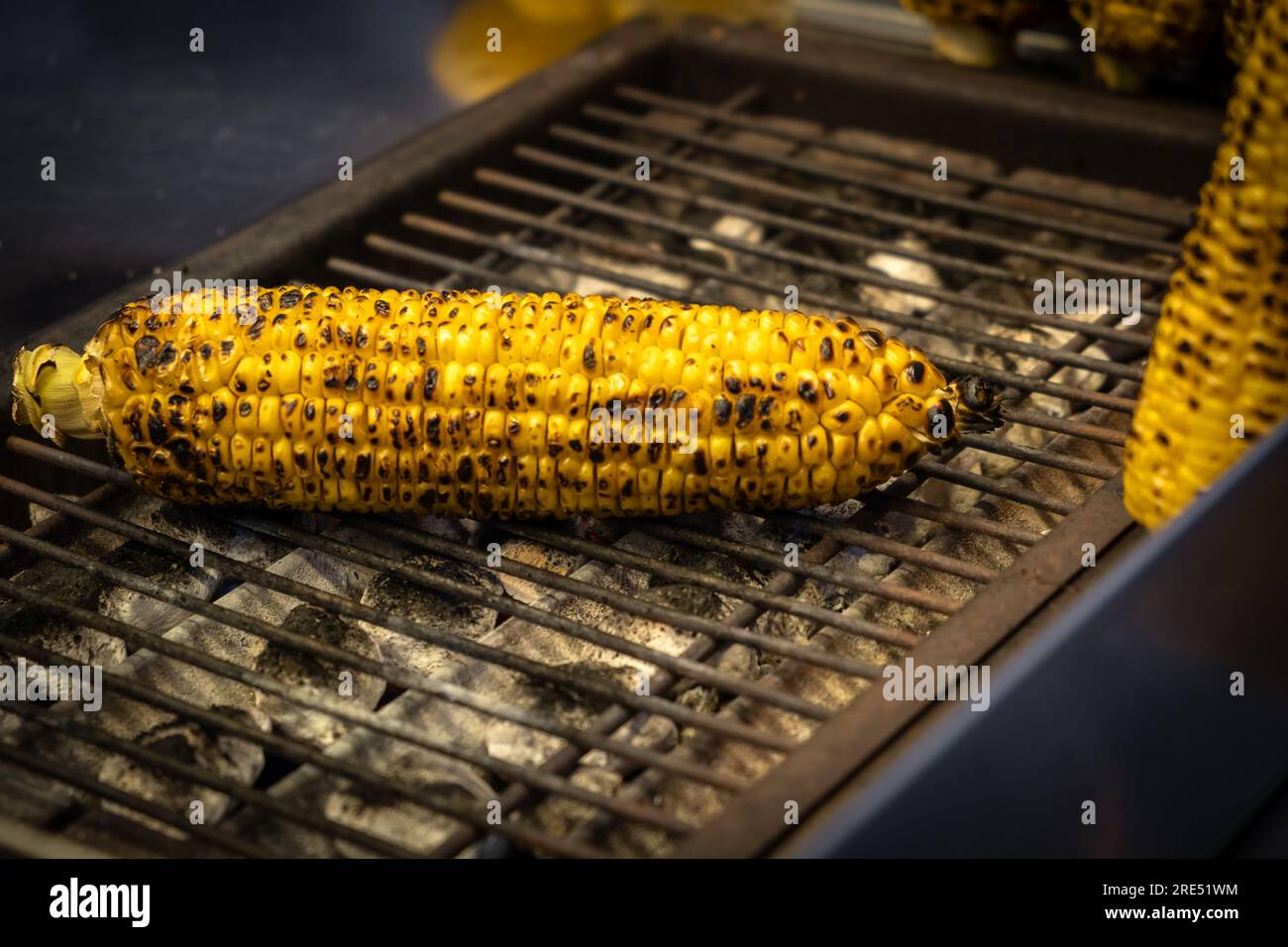 A street vendor roasts corn on a charcoal grill in Istanbul Stock Photo ...