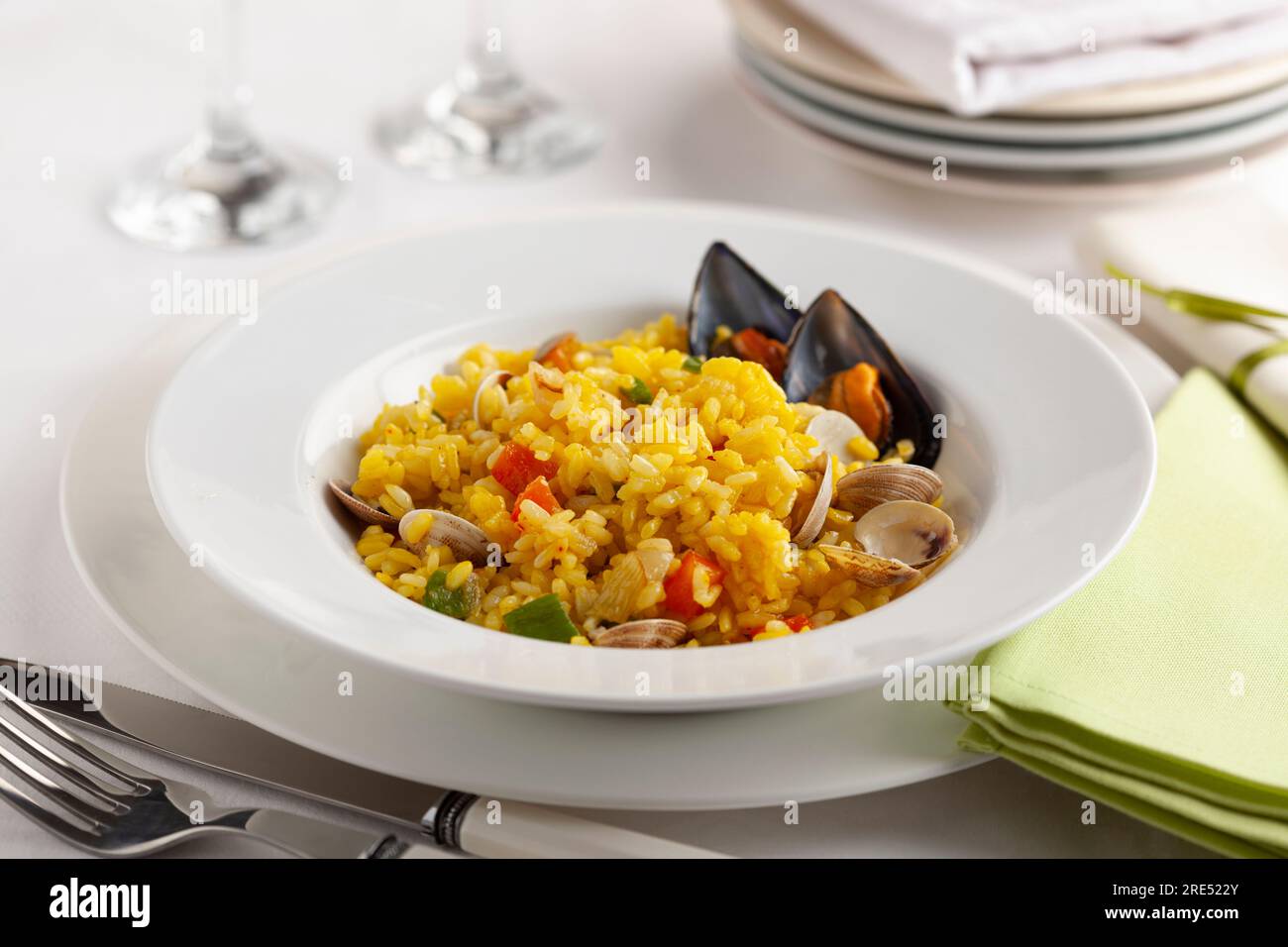 seafood paella in plate on elegant background Stock Photo - Alamy