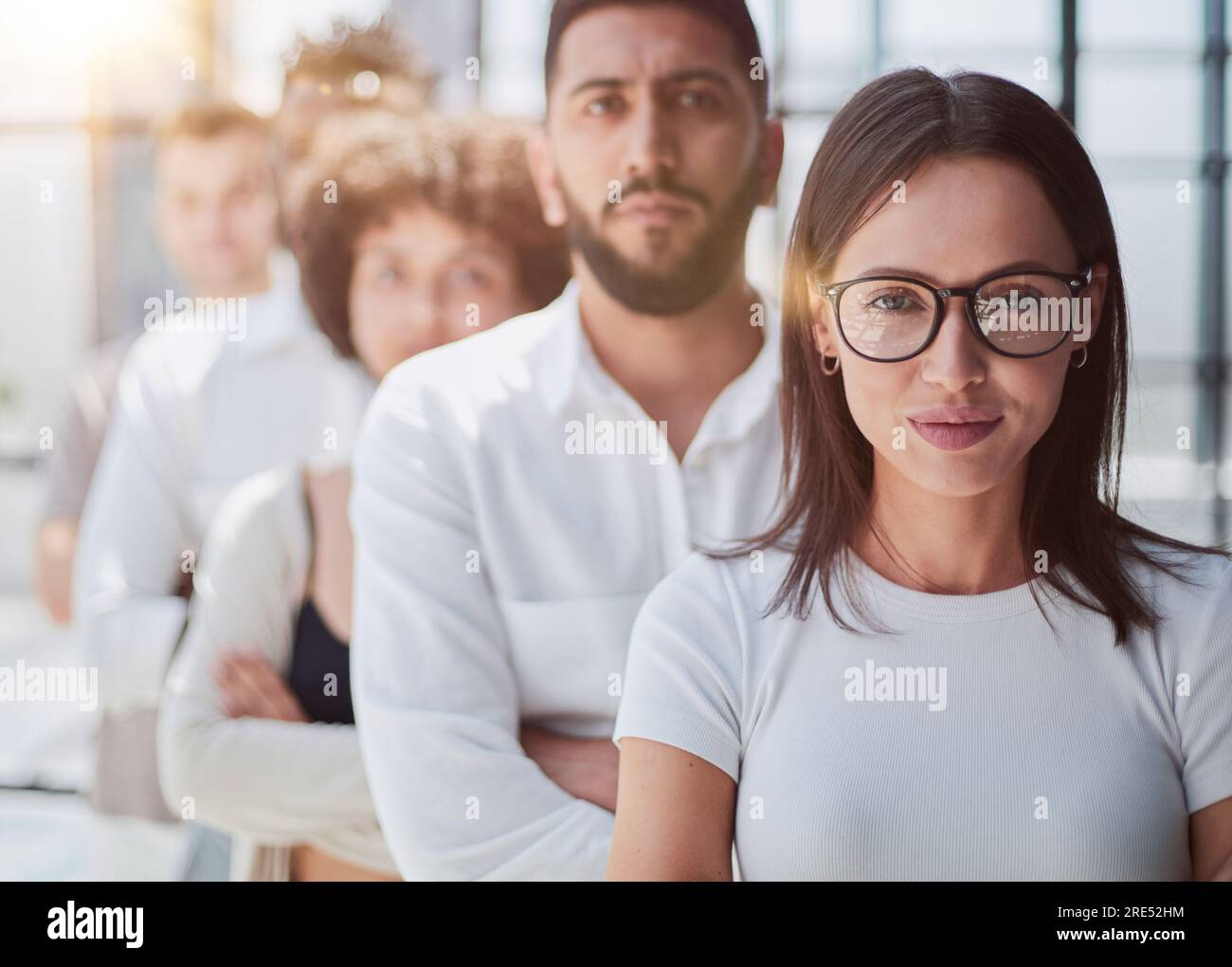 Smiling professional business leaders and employees group team portrait ...