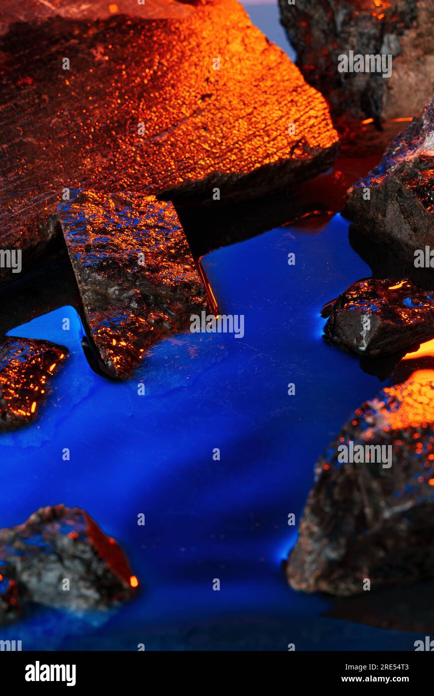Stones and water illuminated by colored light Stock Photo - Alamy
