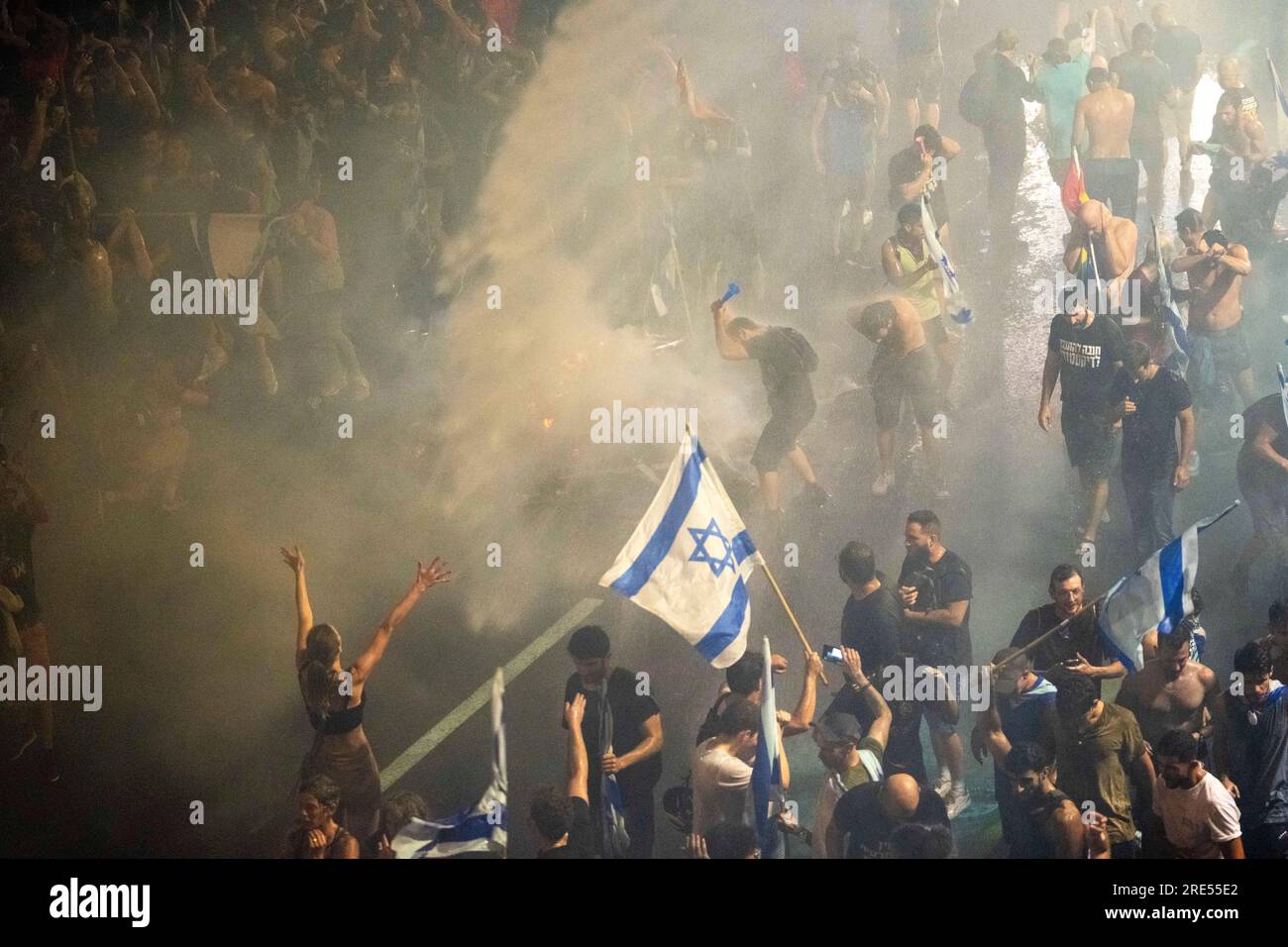 Riot police use water cannon to clear demonstrators with a water canon ...