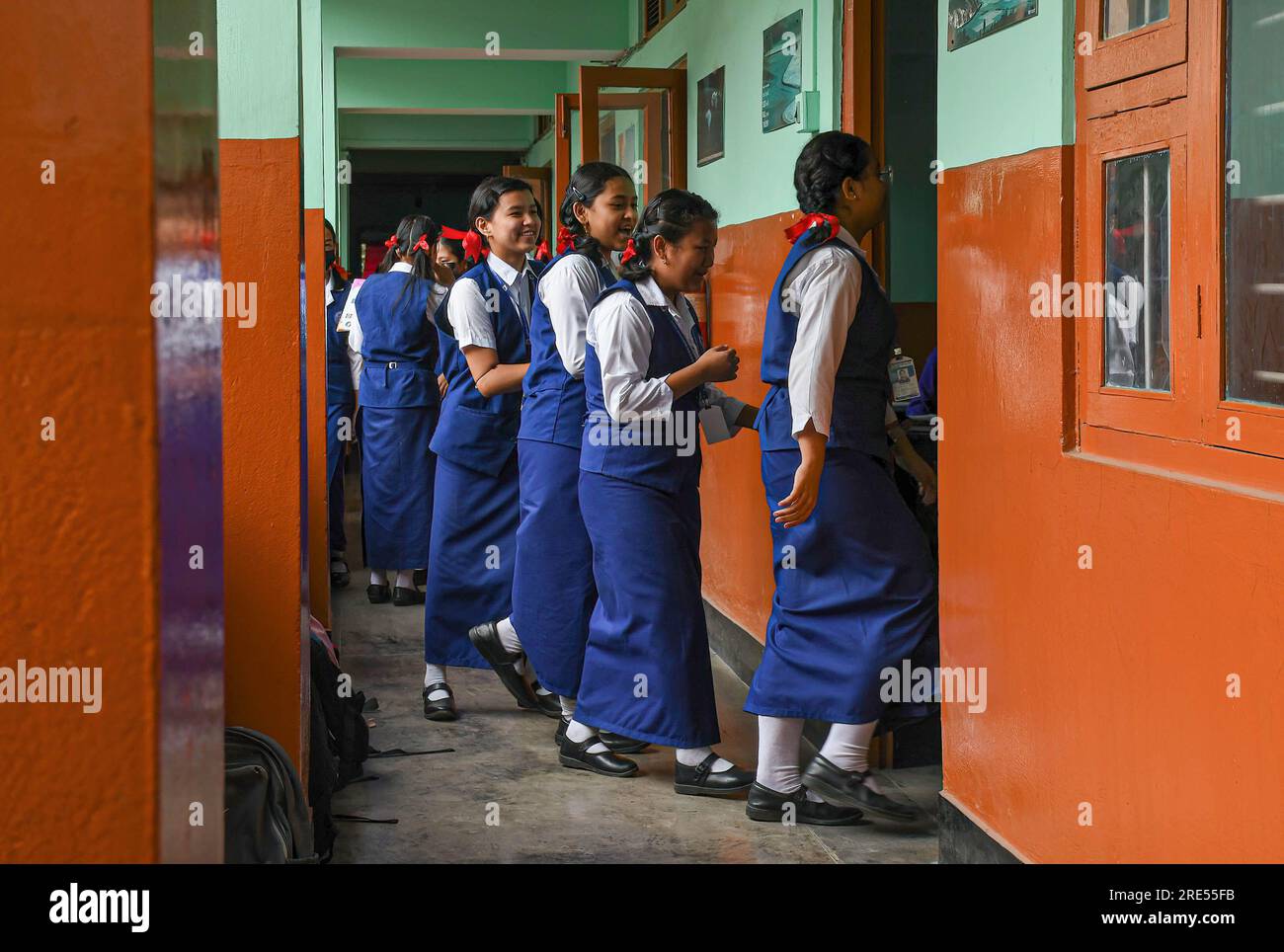 Students play outside their classroom as they wait for their teacher at ...