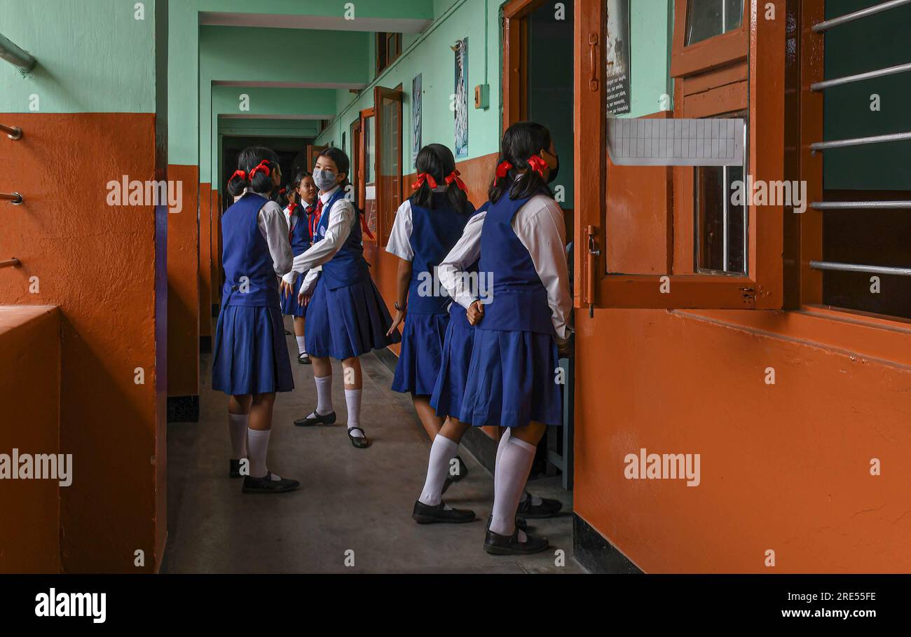 Students play outside their classroom as they wait for their teacher at ...