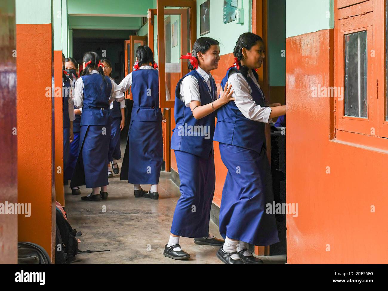 Students play outside their classroom as they wait for their teacher at Nirmalabas High School ...