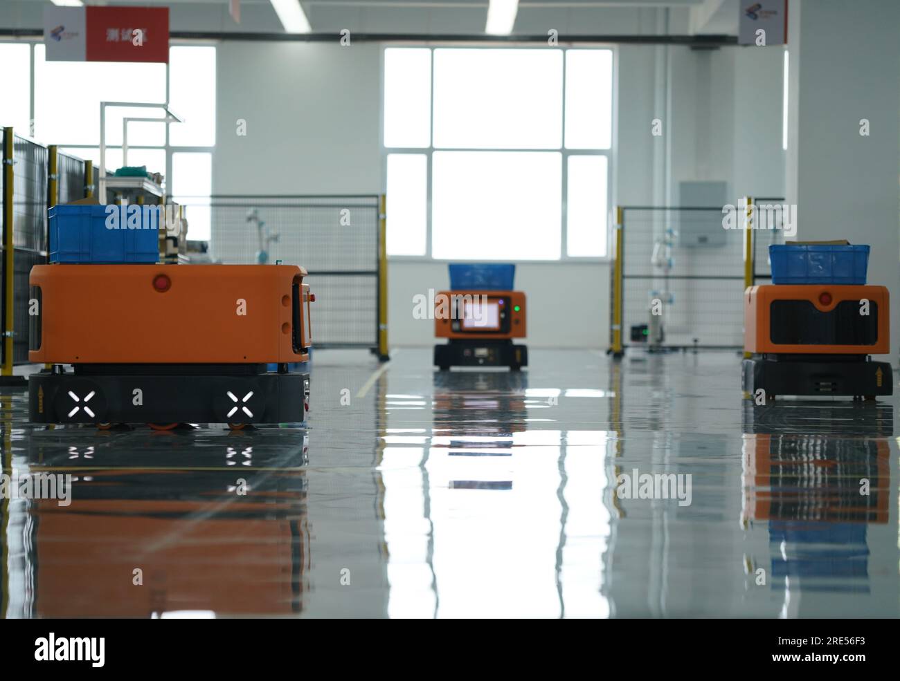 Zibo, China's Shandong Province. 25th July, 2023. Robots deliver items ...
