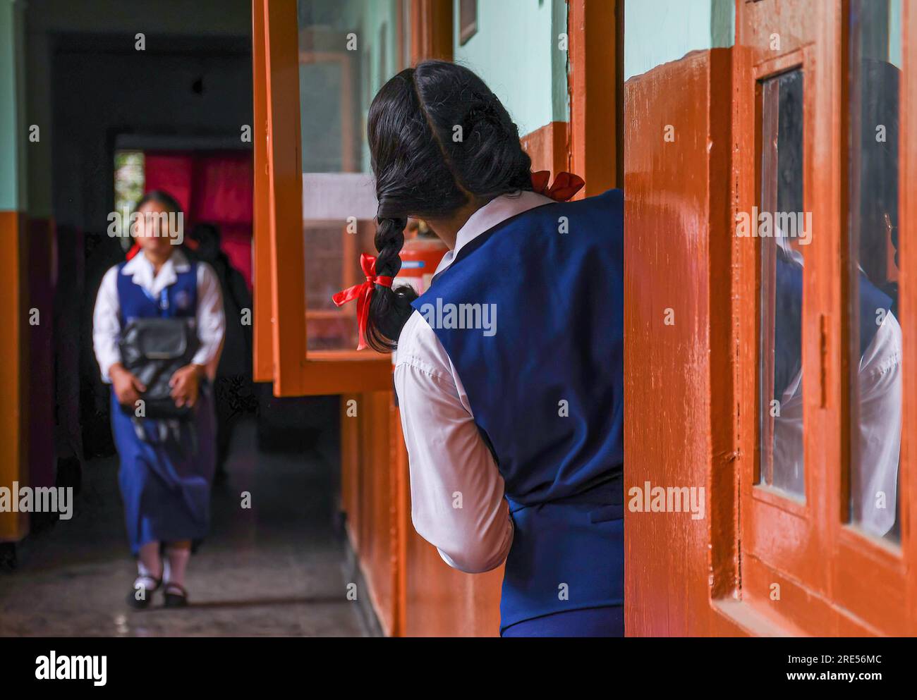 July 16, 2023, Imphal, Manipur, India: A student stands outside her ...