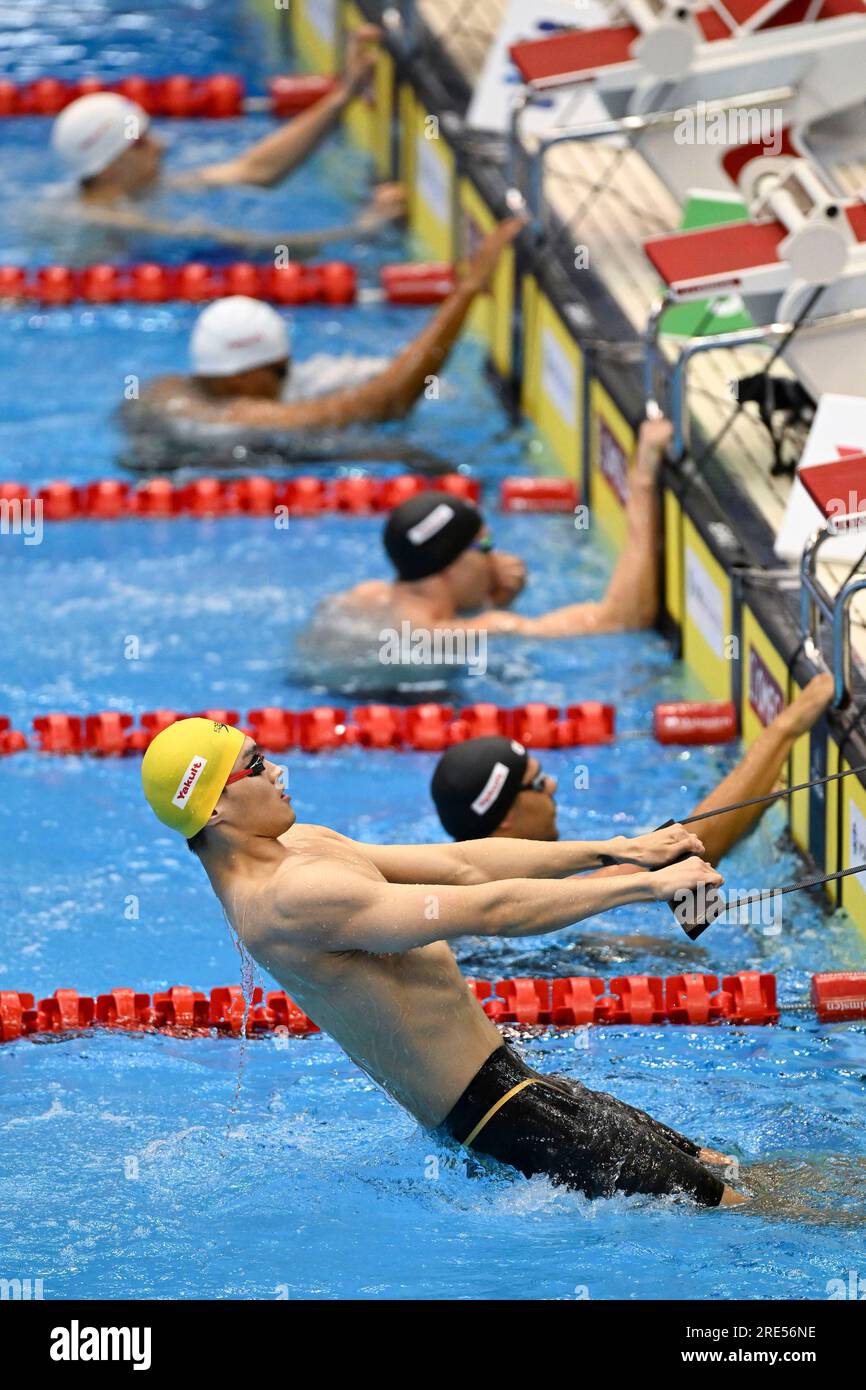 Fukuoka, Japan. 25th July, 2023. Xu Jiayu (bottom) of China reacts ...
