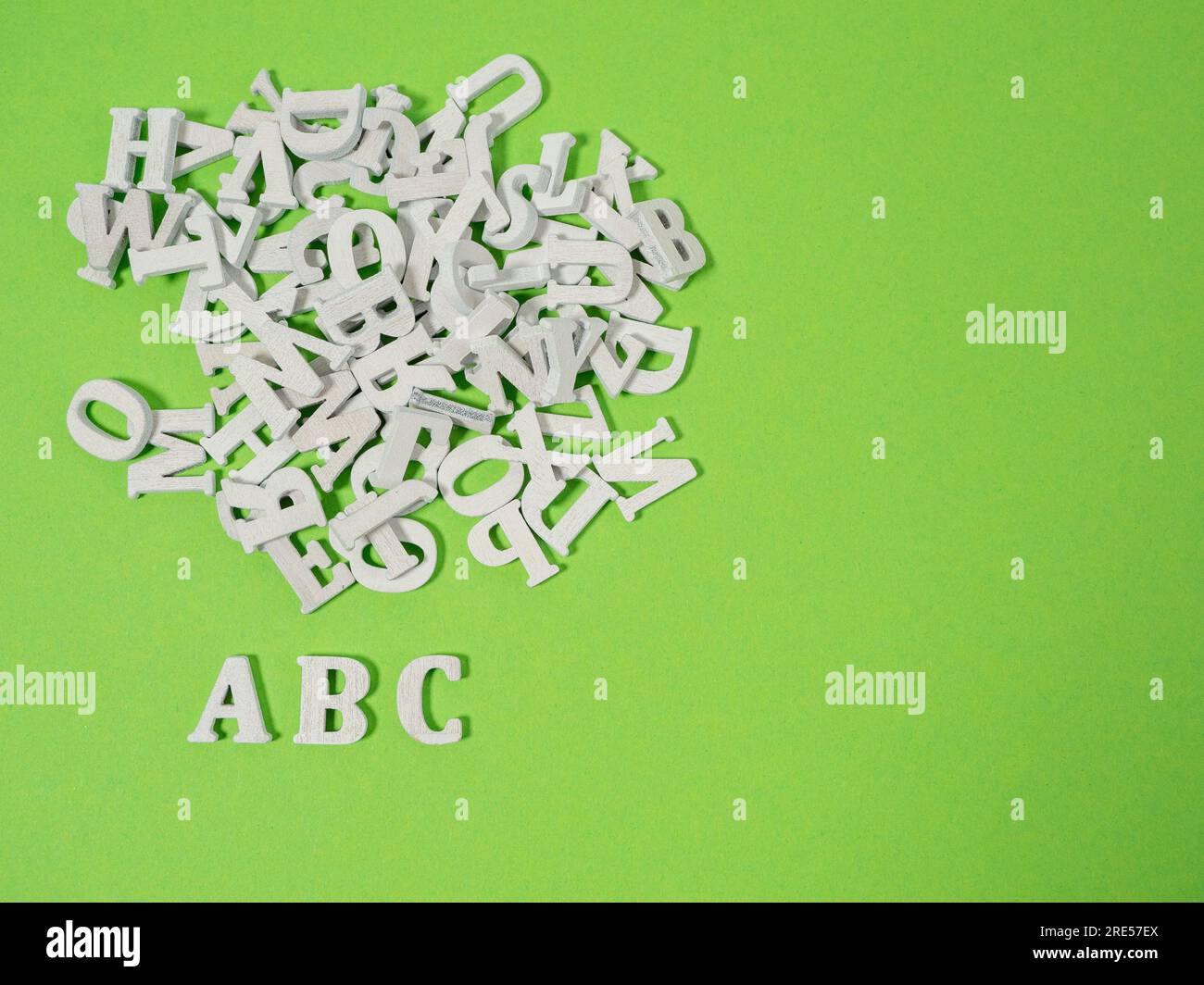Wooden letters on a green background. Wooden letters abc concept of ...