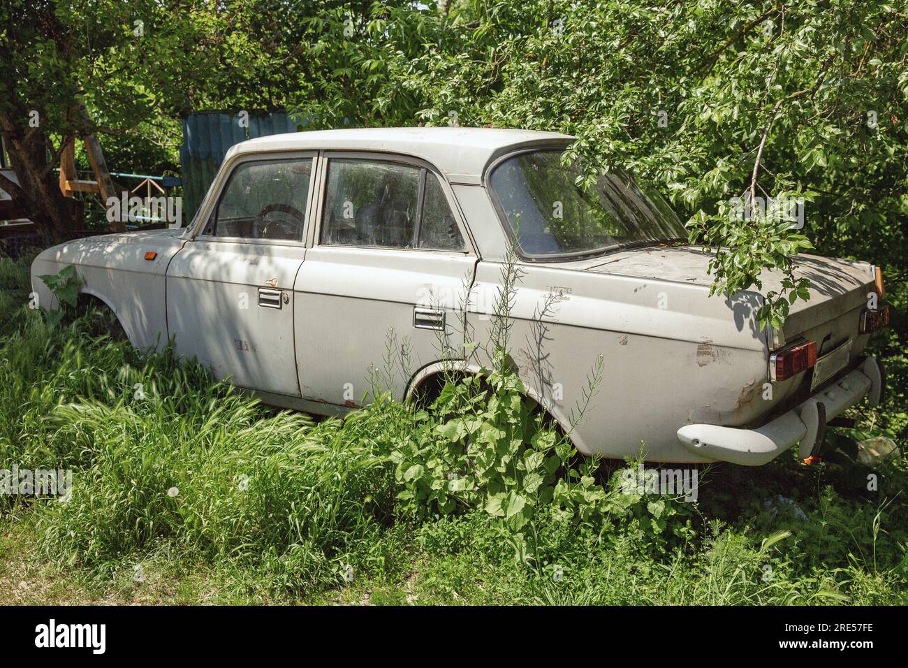 Old destroyed car at a garbage dump in the forest Stock Photo - Alamy