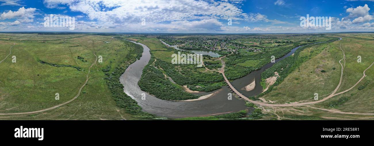 Aerial drone top view over Sluch river and Liukhcha village in Rivne ...