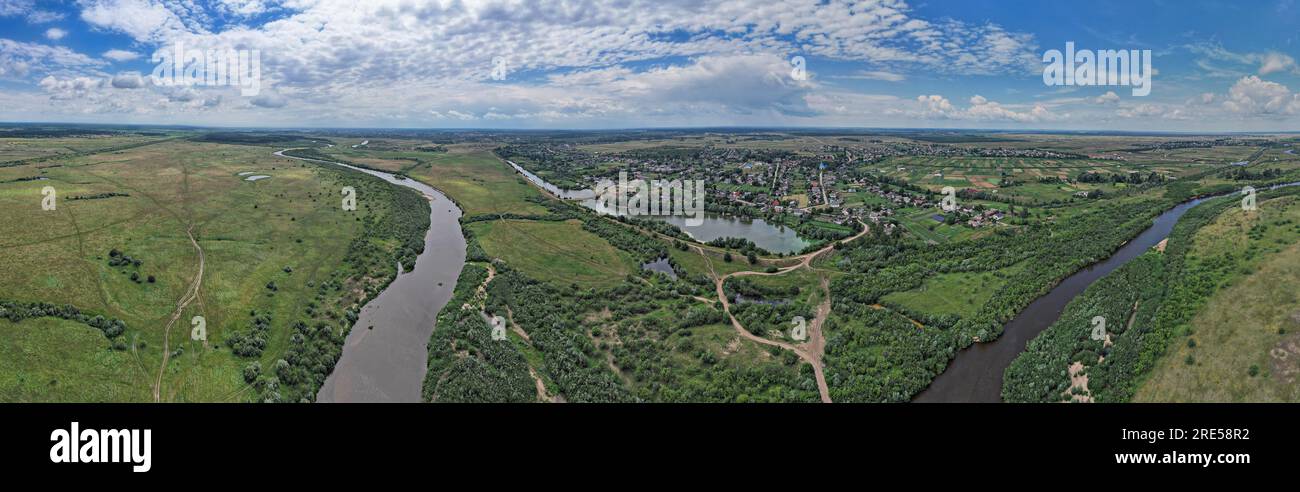 Aerial drone top view over Sluch river and Liukhcha village in Rivne ...