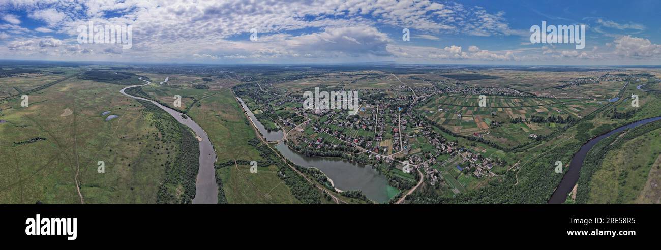 Aerial drone top view over Sluch river and Liukhcha village in Rivne ...